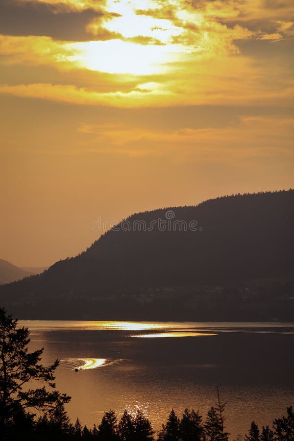 Dramatic Vertical View of a Beautiful Sunset Over the Silhouette of a ...