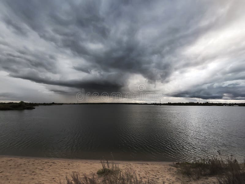 A Dramatic View of the Lake Above Which a Dark Cloud Has Formed. Stock ...