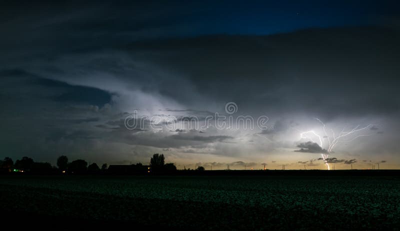 Large Storm Cloud, Spawning Upward Lightning Stock Photo - Image of ...