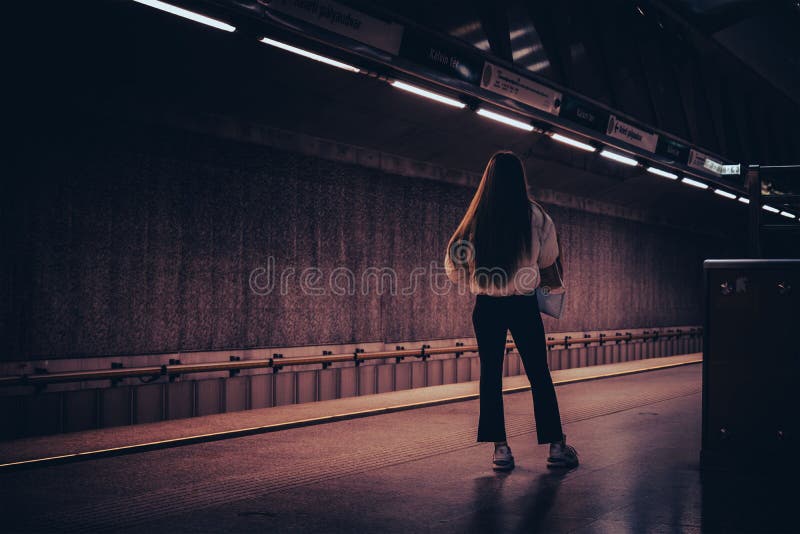 Dramatic View of a Woman Waiting for a Train in the Underground Stock ...