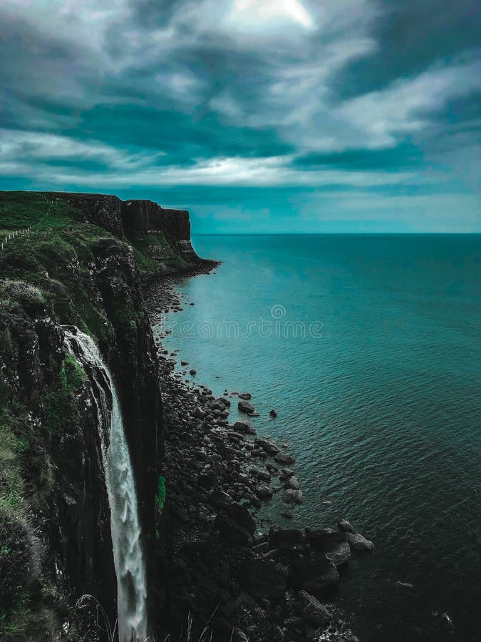 Dramatic waterfall to sea stock image. Image of dramatic - 264245493