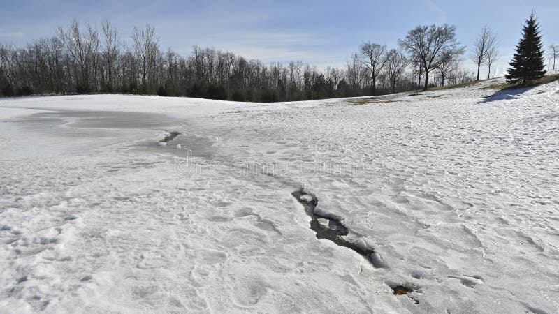 Dramatic Wide-angle View of Breaking Up of Ice Surface in the Park ...