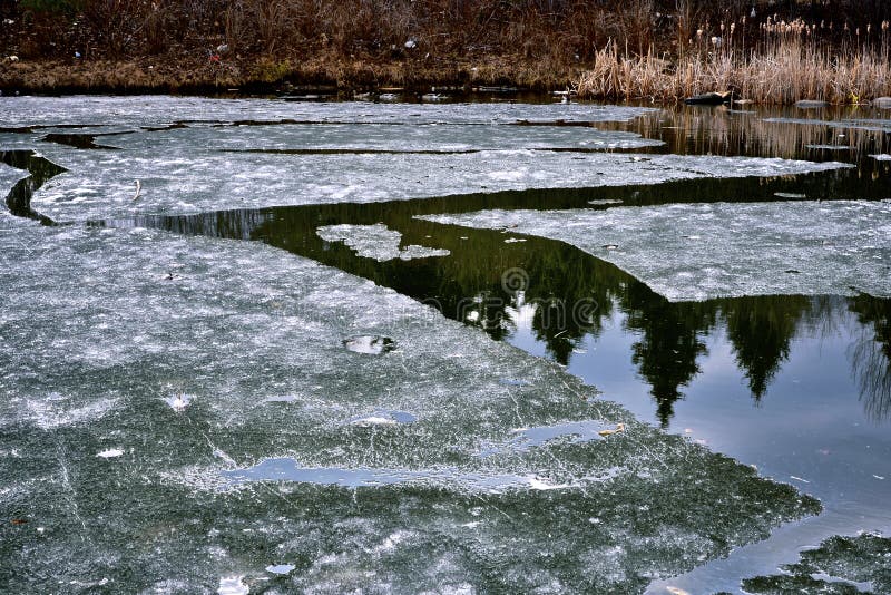 Dramatic Wide-angle View of Breaking Up of Ice Surface at the Pond in ...