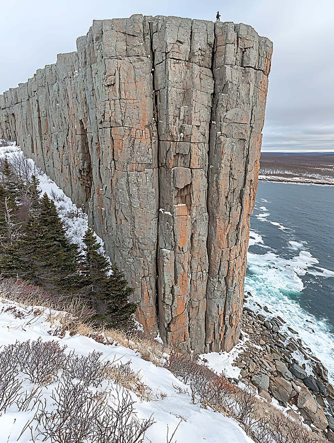 Dramatic Winter Landscape Featuring a Towering Cliff Face, Textured ...