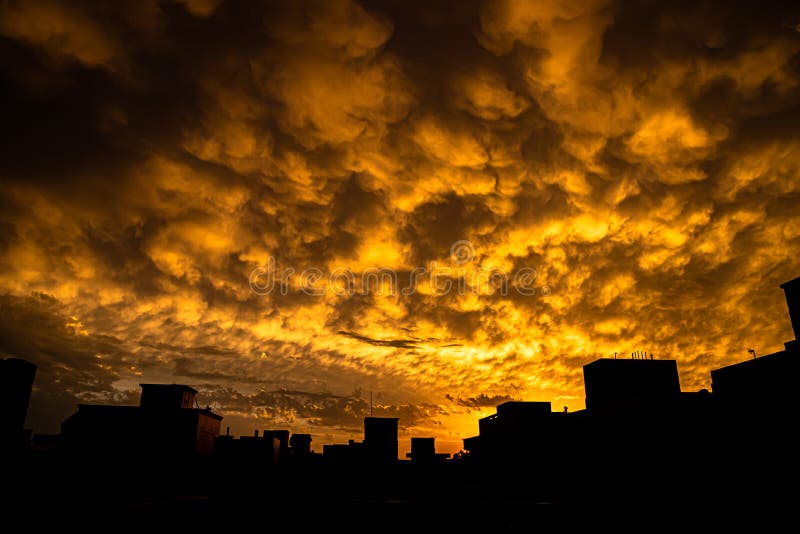 Dramatic Yellow Clouds Over the Building Stock Photo - Image of dusk ...