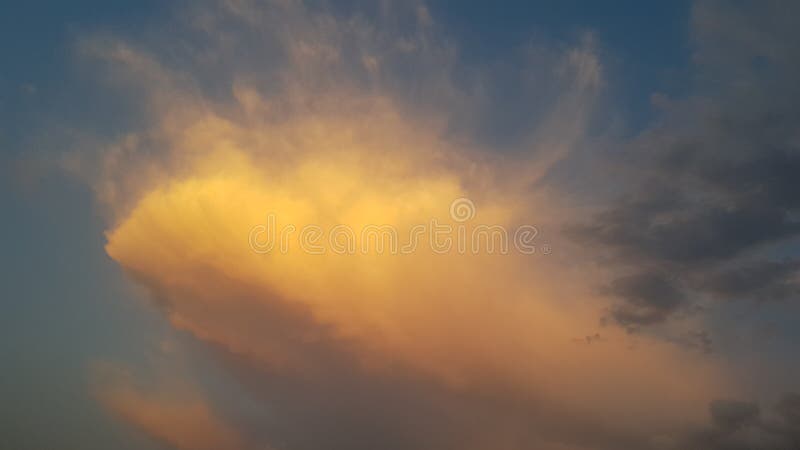 Dramatic Yellow and Orange Sunset Sky with Clouds and Sun Rays Stock ...