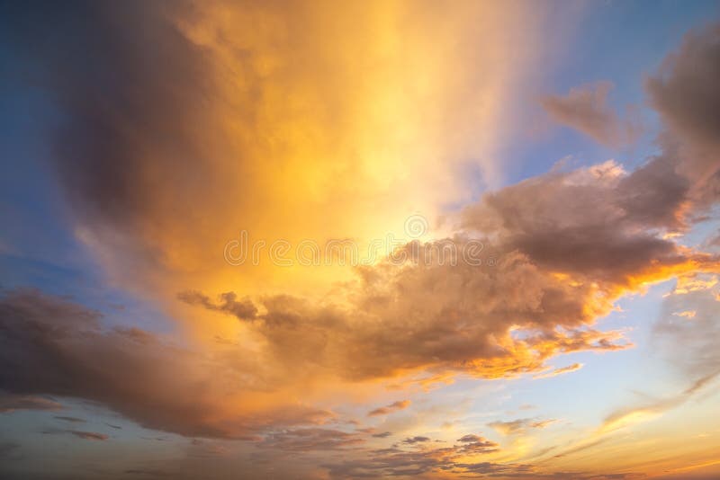 Dramatic Yellow Sunset Landscape with Puffy Clouds Lit by Orange ...