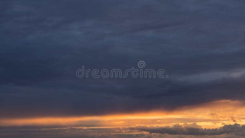 Dramatic Yellow Sunset with Vibrant Clouds Lit by a Sun Stock Image ...