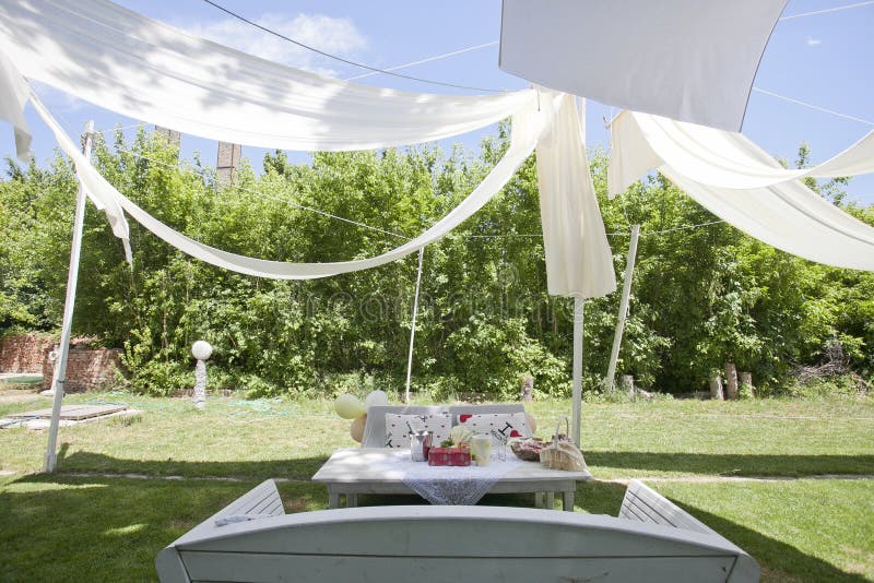 Drape Shade Over a Table during a Party at a Lawn Stock Photo - Image ...