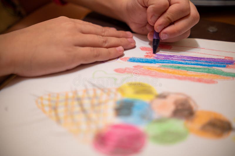 Draw with Colored Pencils on a White Sheet of Paper. Stock Image ...