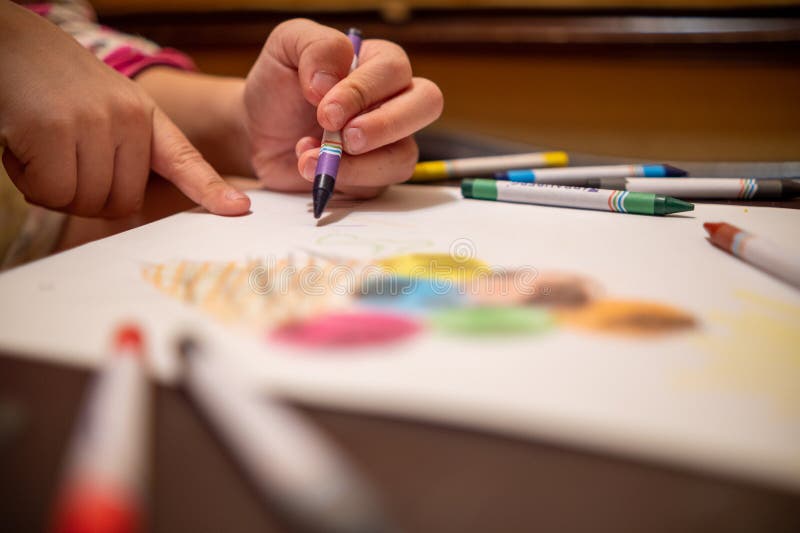 Draw with Colored Pencils on a White Sheet of Paper. Stock Image ...