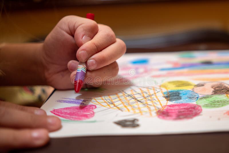 Draw with Colored Pencils on a White Sheet of Paper. Stock Photo ...