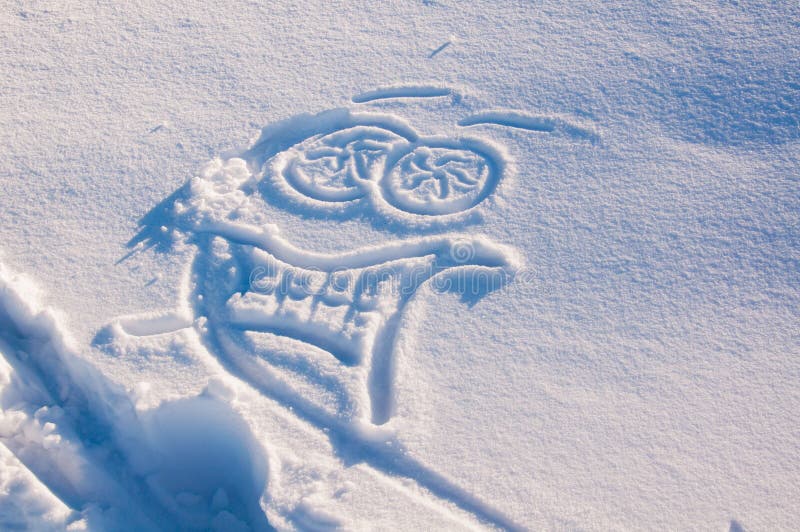 Draw of a face on snow stock photo. Image of season - 230018442
