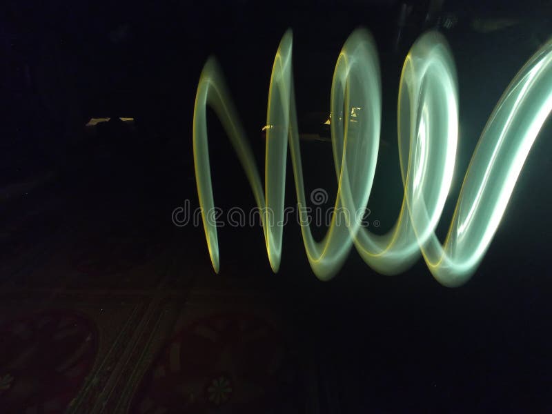 Draw a Spiral Using the Light Painting Technique, with Green Lights ...