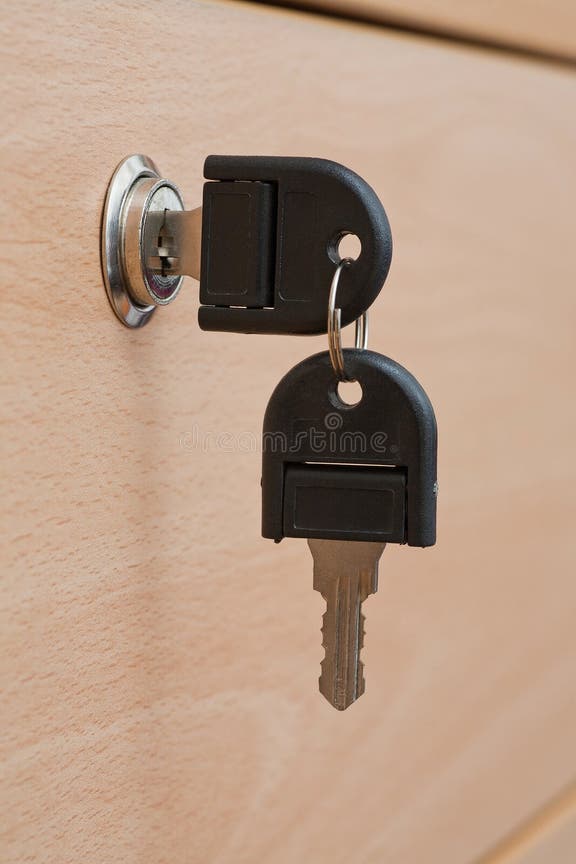 Drawer with Key in Lock stock image. Image of office - 18592035