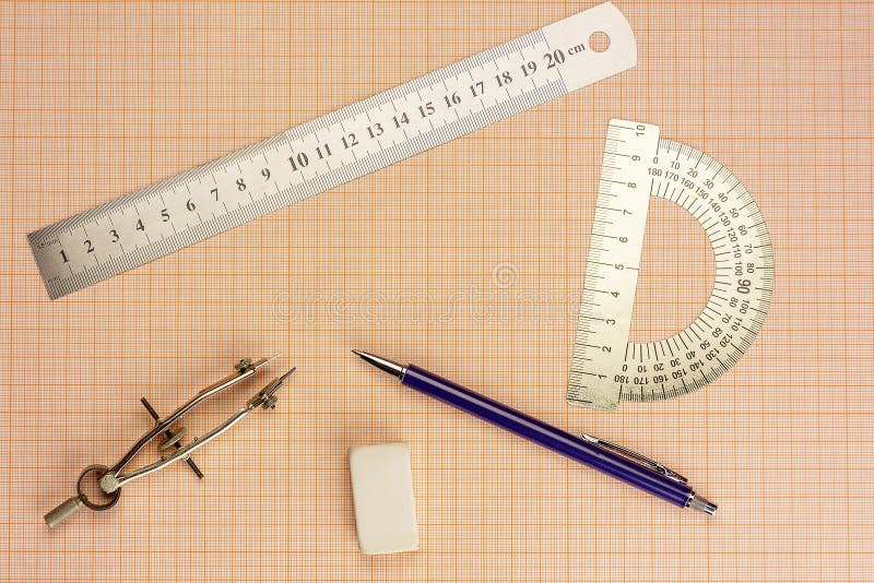 Drawing Accessories Lie on a Sheet of Graph Paper Stock Photo - Image ...