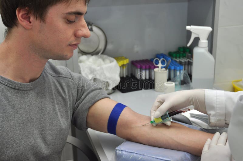 Drawing blood from patient stock image. Image of biology - 15429145
