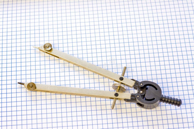 Drawing Compass in Graph Paper Stock Photo - Image of office, tools ...
