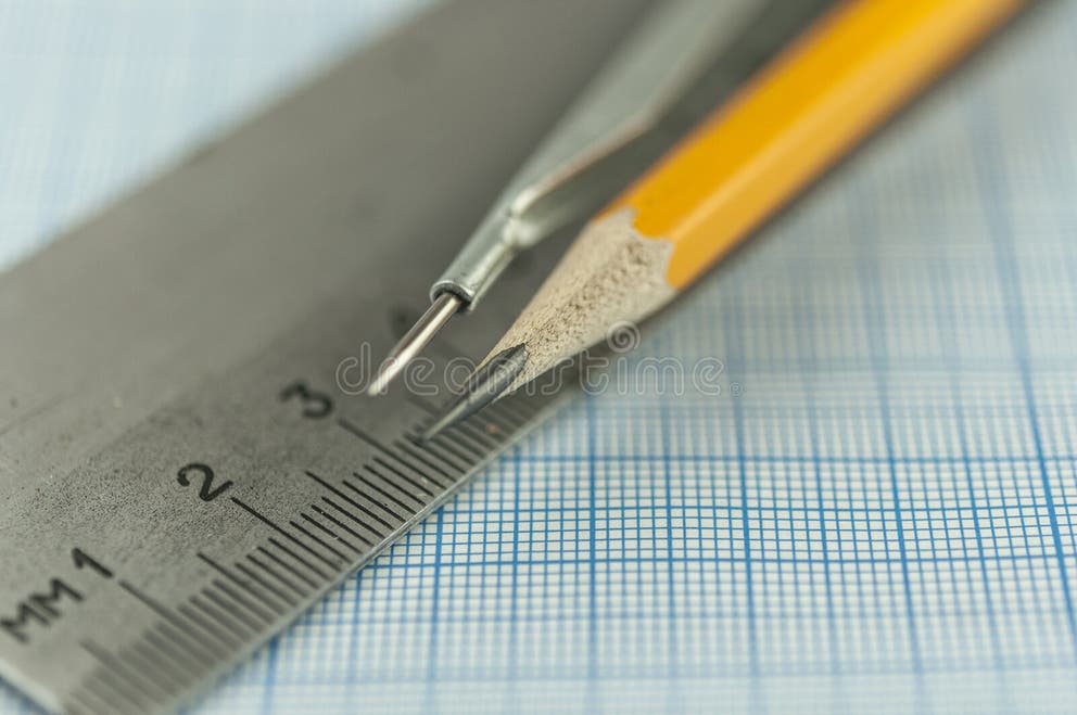 Drawing Compass, Pencil, and Ruler on Graph Paper Background Stock ...
