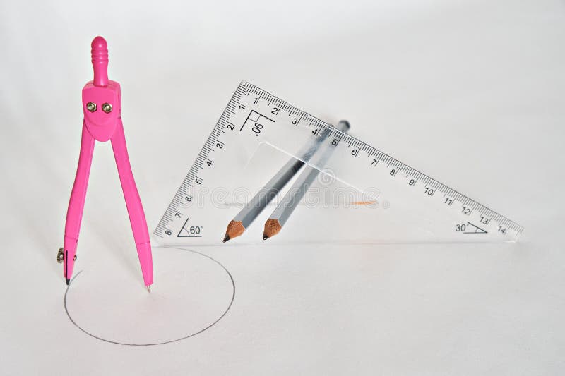A Drawing Compass and a Triangular Ruler with Two Pencils in the Middle ...