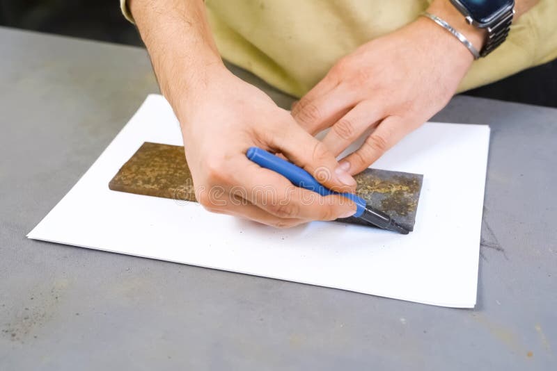 Drawing Dimensions of the Part on Paper Around the Perimeter of Stock ...