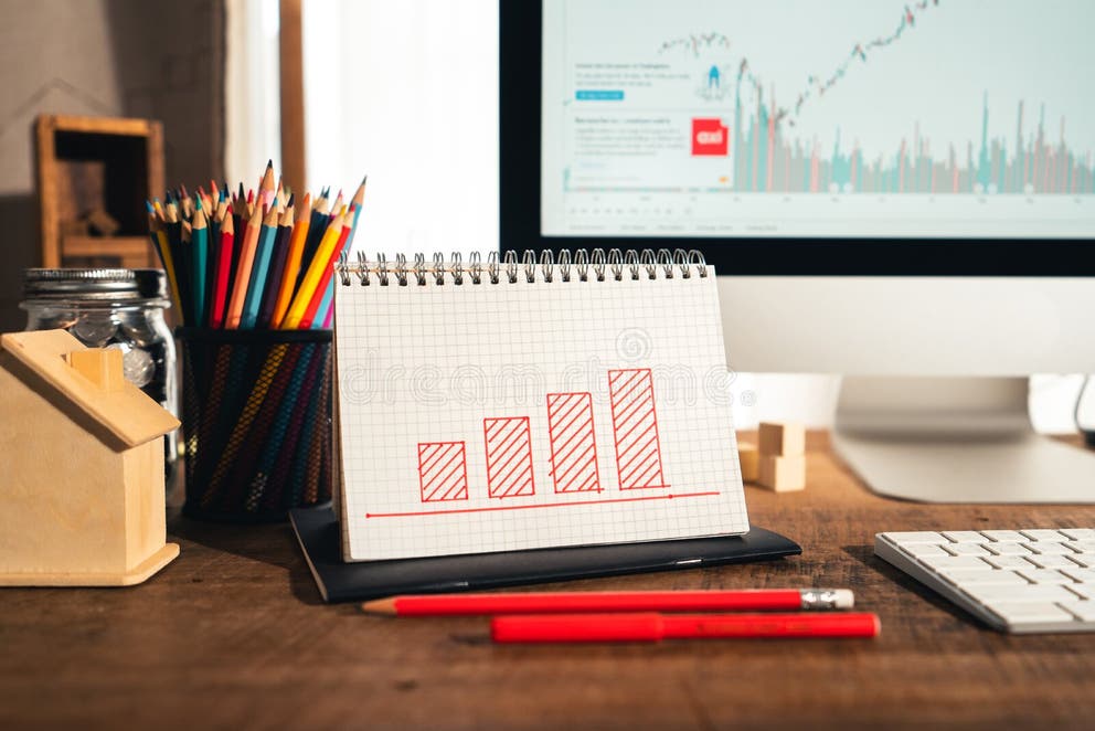 Drawing a Graph of Growth in a Notebook on Your Desk at Home Stock ...