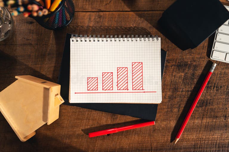 Drawing a Graph of Growth in a Notebook on Your Desk at Home Stock ...