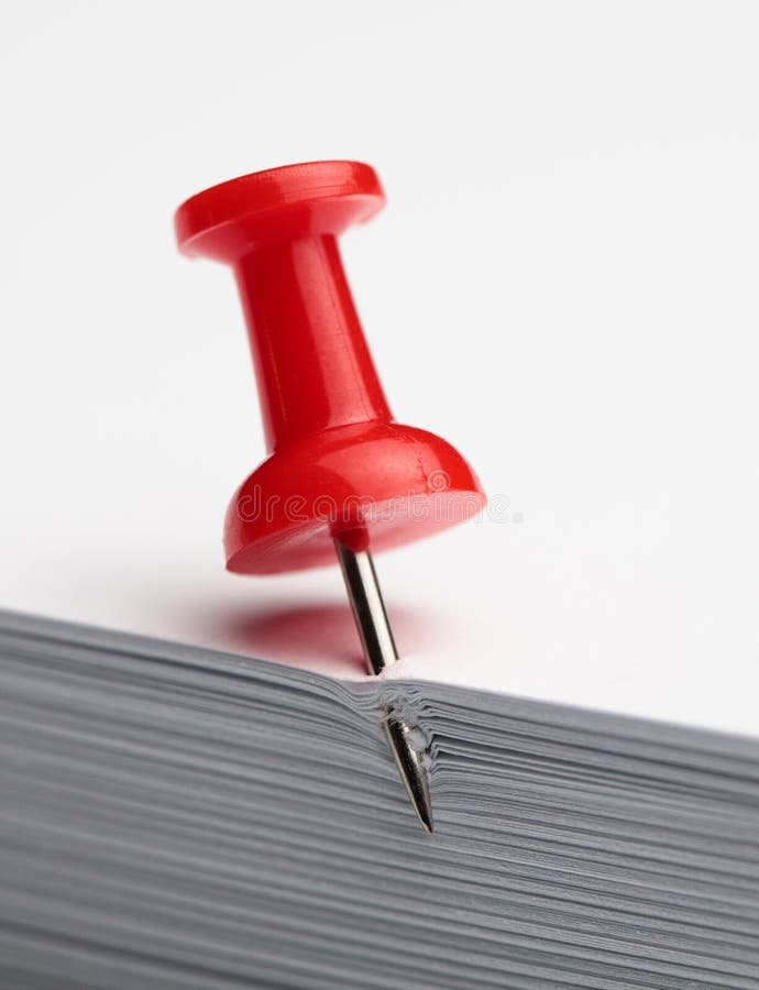 Drawing pin in paper pile stock photo. Image of pile - 24654942