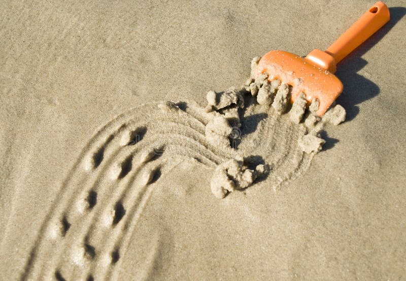Drawing on the sand stock photo. Image of rake, summer - 21557996