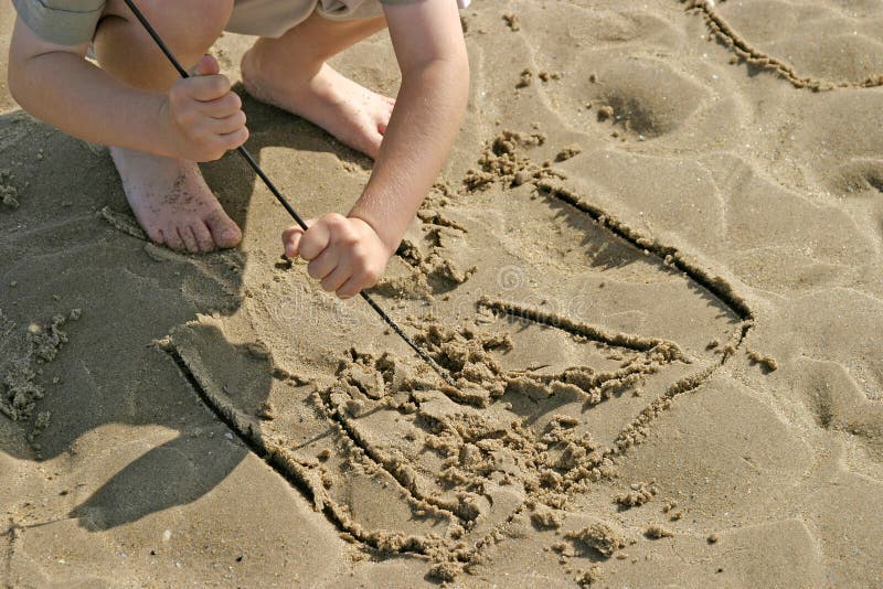 Boy Drawing Sand Stick Stock Photos - Free & Royalty-Free Stock Photos ...