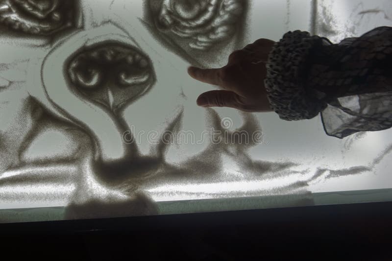 Drawing, Sand on the Light Panel, a Female Hand Draws Sand, Sand Stock ... Drawing, Sand on the Light Panel, a Female Hand Draws Sand, Sand Stock ...