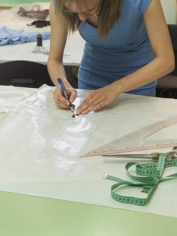 Drawing Schemes on Tracing Paper. Tailor`s Business. Stock Image ...