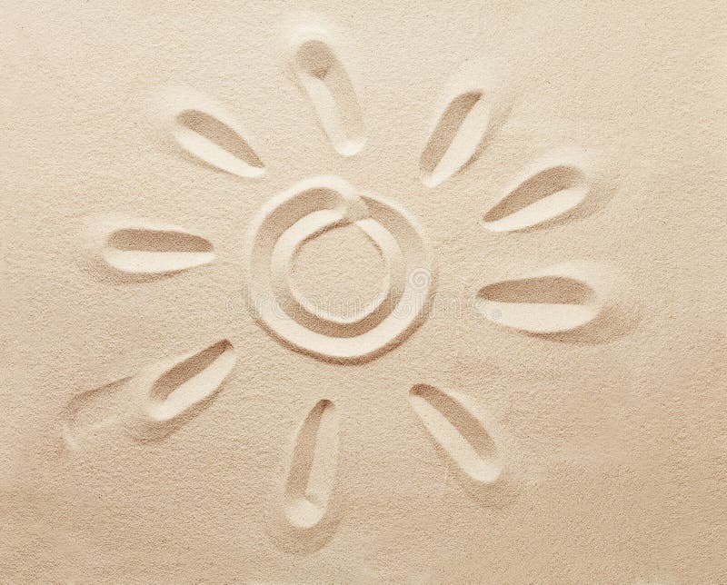 Drawing of the Smiling Sun on Sand. Beach Sand Texture Stock Image ...