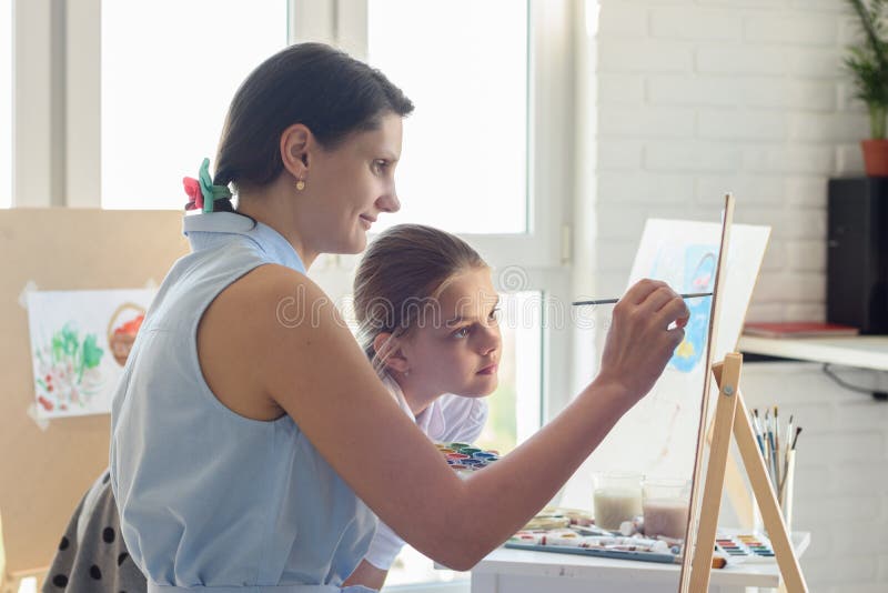 Drawing Teacher Shows Girl How To Draw Stock Image - Image of artist ...