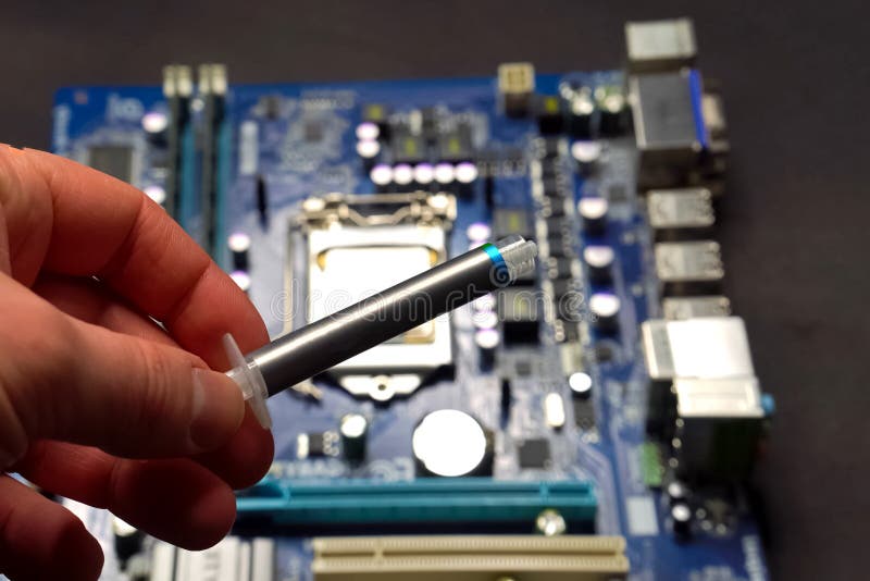 Drawing Thermal Paste on Computer Processor. Installing a Cooling ...