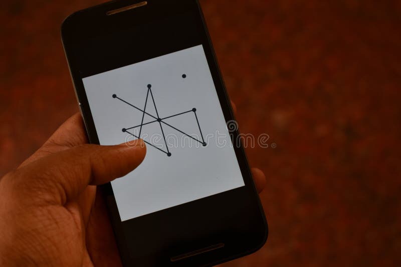 Drawing Unlock Pattern on a Smart Phone. Concept about Smart Phone ...