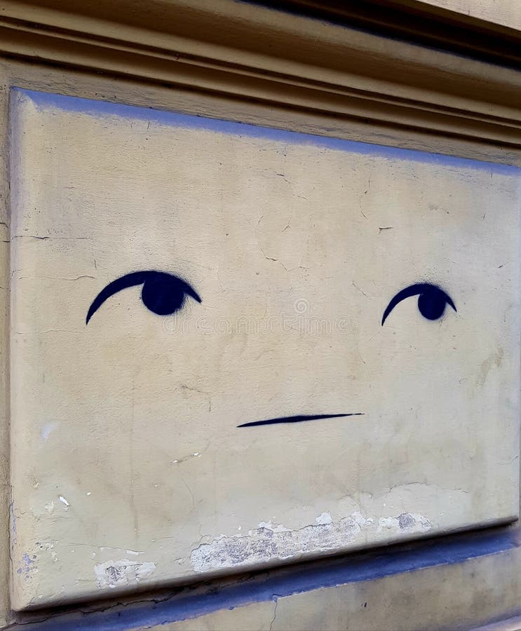 Drawing on the Wall of an Old Building with a Sad Face Stock Image ...