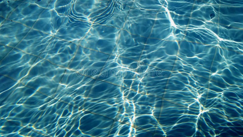 Drawings on the Wave of Water in Blue Swimming Pool Stock Photo - Image ...