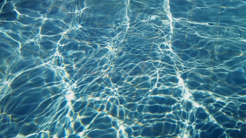 Drawings on the Wave of Water in Blue Swimming Pool Stock Photo - Image ...
