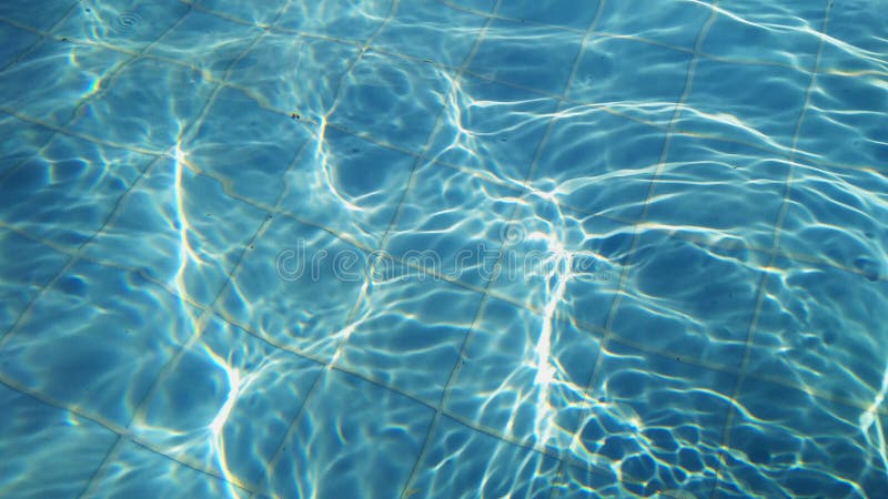 Drawings on the Wave of Water in Blue Swimming Pool Stock Image - Image ...