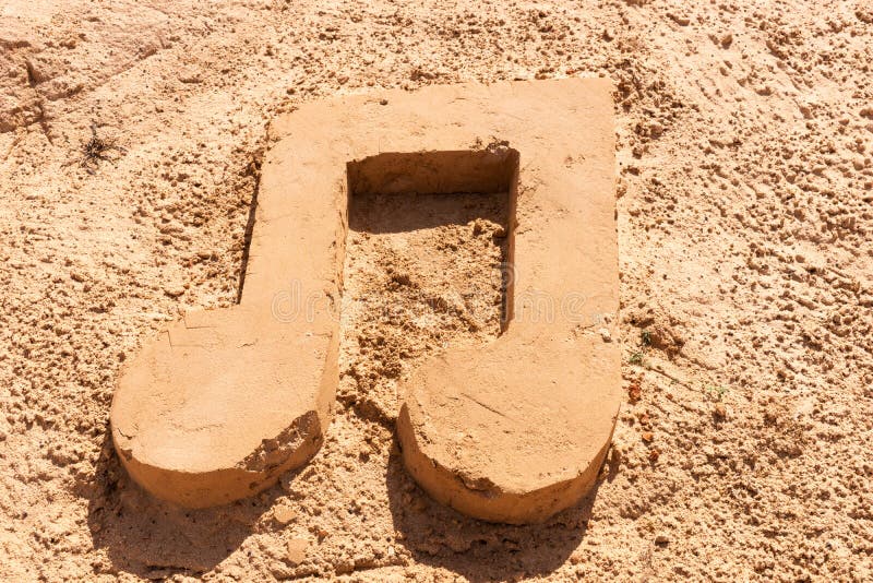 Drawn Musical Note on the Sandy Beach Stock Photo - Image of sculpture ...