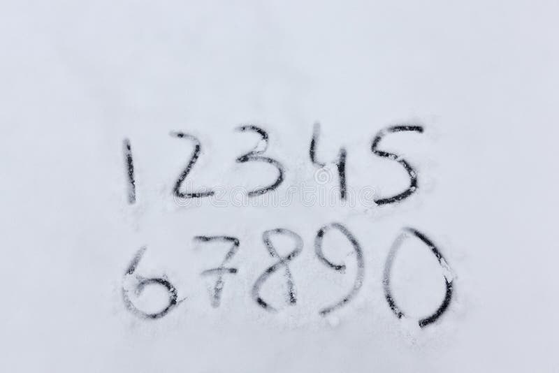 Drawn numbers on the snow stock photo. Image of inspiration - 228529266