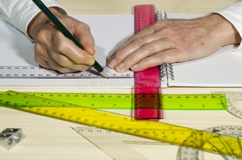 Draws with a ruler stock image. Image of tools, work - 91667727