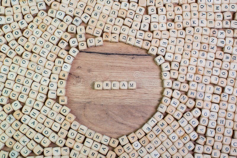 Dream Name in Letters on Cube Dices on Table Stock Image - Image of ...