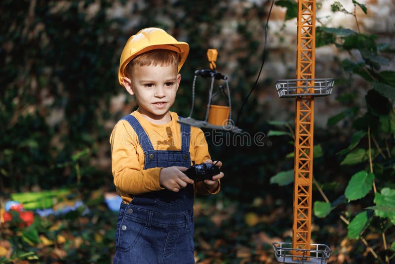 Dreaming of Future Profession. Little Boy Builder in Uniform Working on ...