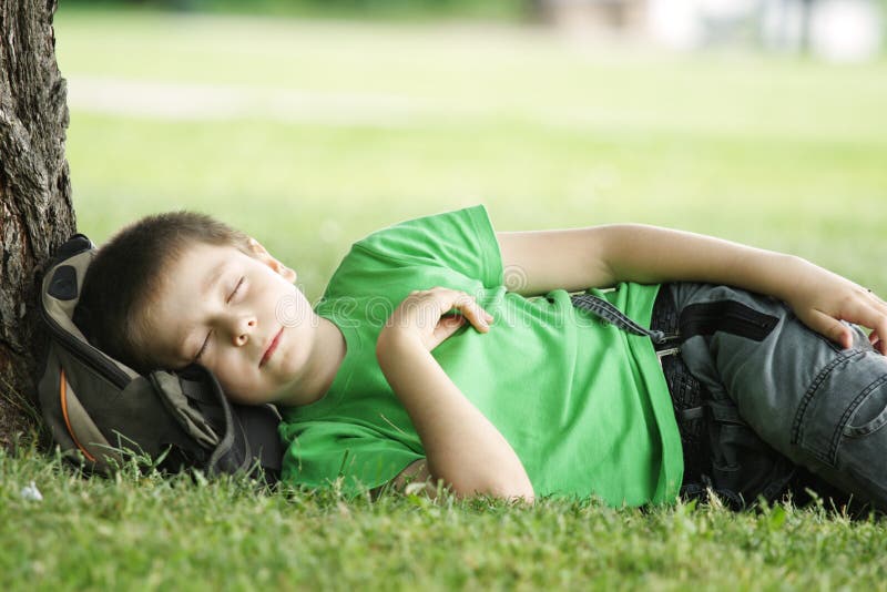 Boy Laying Down Under Tree Stock Photos - Free & Royalty-Free Stock ...