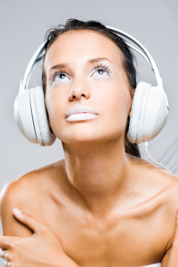 Dreamy Looking Young Music Listener. Stock Image - Image of brunette ...