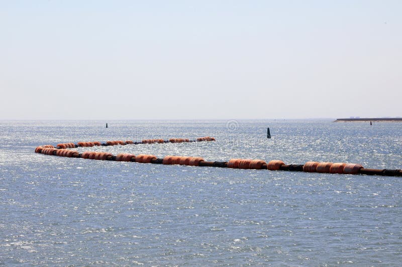 Dredge pipe and buoy stock image. Image of terminals - 386963231