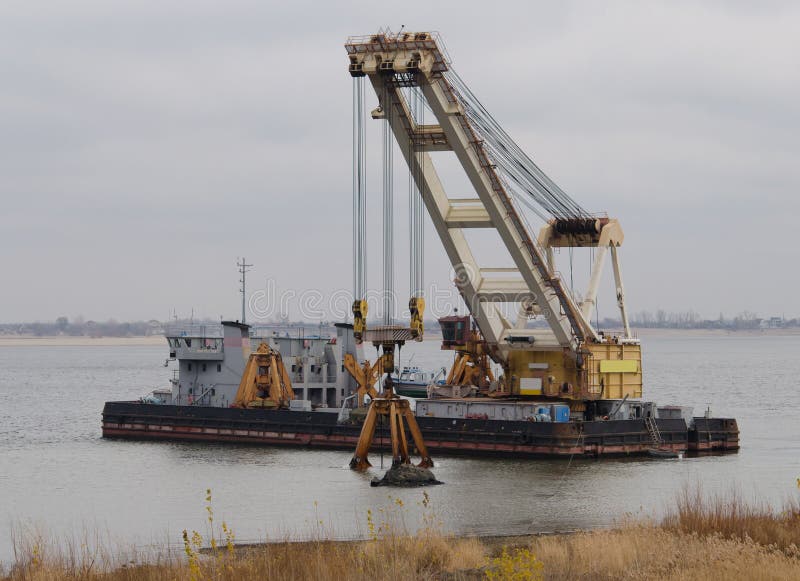 Dredger ship on the river stock image. Image of beach - 63129809