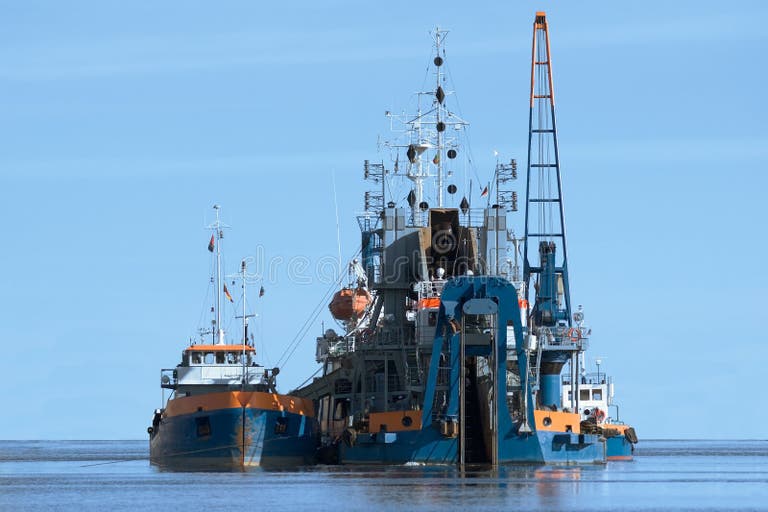 Dredging ship at work stock image. Image of industrial - 2731225